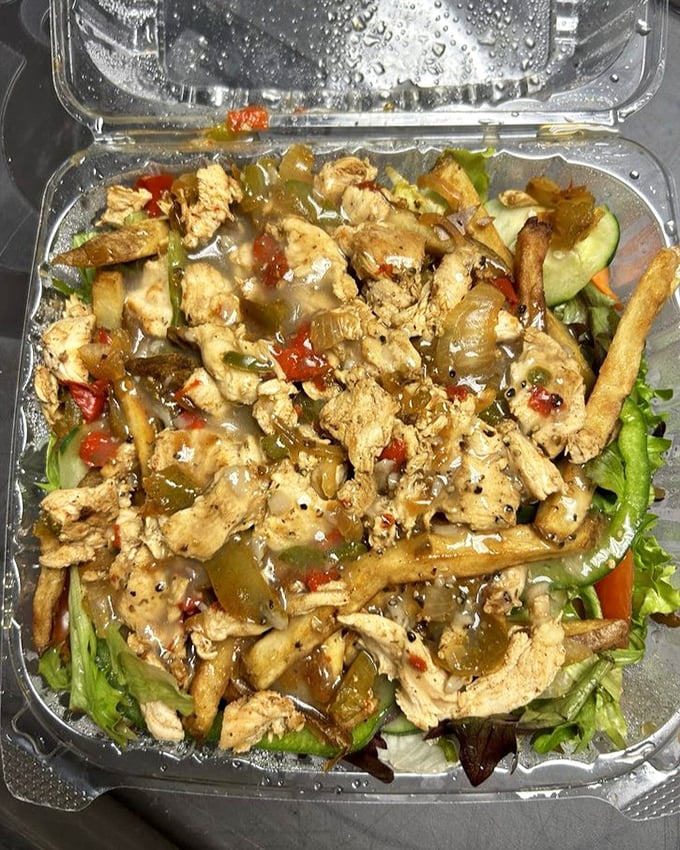 Protein with a purpose—tender chicken strips lounging on a bed of greens like they're at a spa retreat for delicious food.