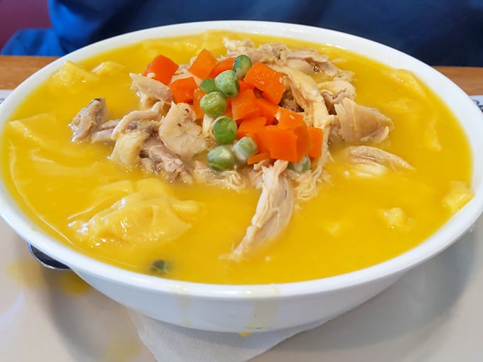 Sunshine in a bowl – chicken and dumplings with vegetables adding pops of color to this comfort classic that warms you from the inside out.