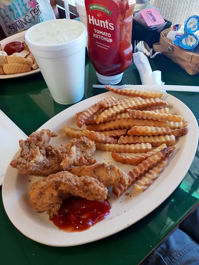 Chicken tenders and crinkle-cut fries—proof that sometimes the simplest pleasures are the most satisfying. Pass the ketchup, please!
