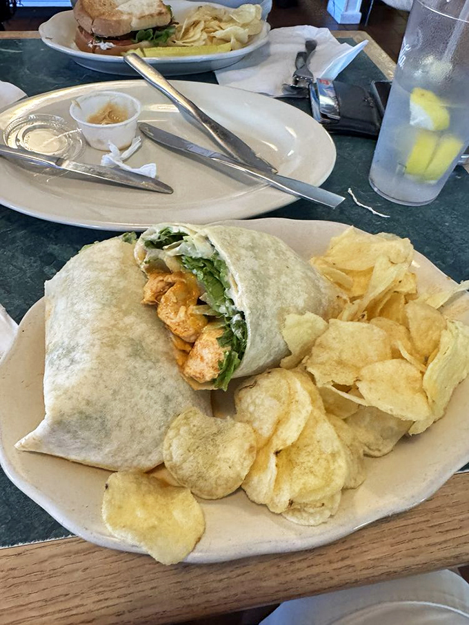The chicken wrap – proof that simple ingredients handled with respect create lunchtime magic that puts sad desk salads everywhere to shame.