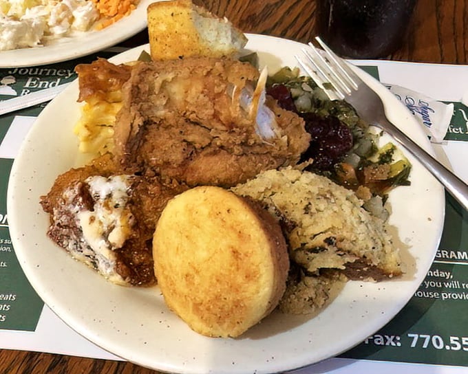 A plate that tells the story of Southern abundance—fried chicken, cornbread, and sides that crowd together like old friends at a reunion.