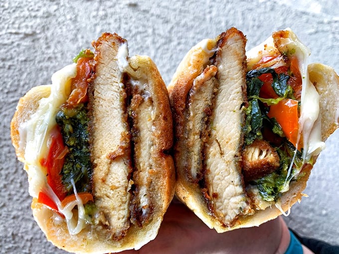 The chicken cutlet sandwich with broccoli rabe – where crispy meets bitter in a dance that your taste buds won't soon forget.