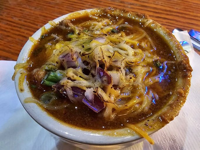Homemade chili that's thick enough to stand a spoon in—the melted cheese cap is just the crowning glory.
