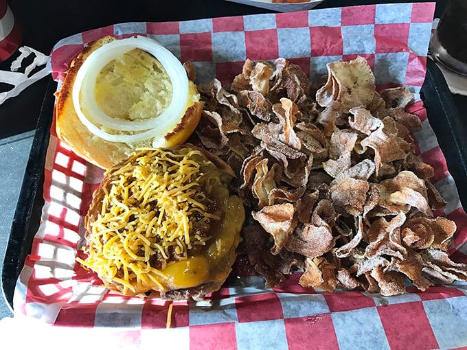 A burger that's dressed to impress with its fried onion strings and pickle slice – like a tuxedo for your taste buds.