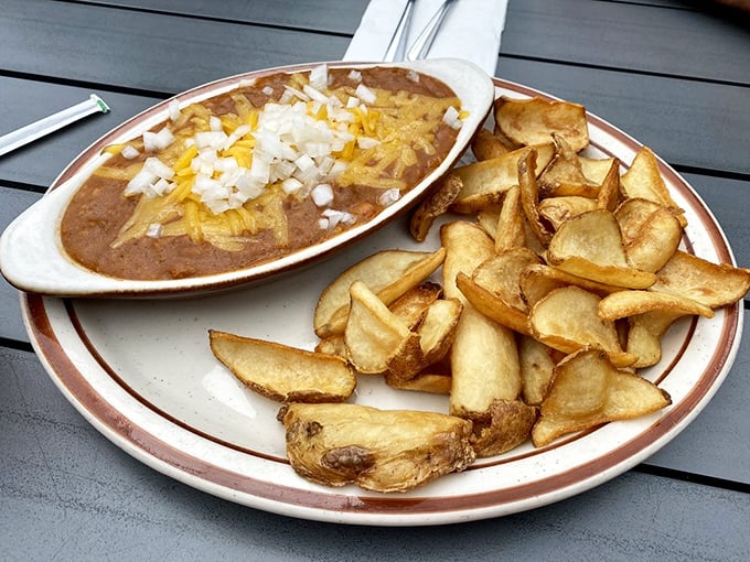 Chili cheese fries that laugh in the face of diet plans. That melted cheese and onion topping is worth every extra minute on the treadmill.