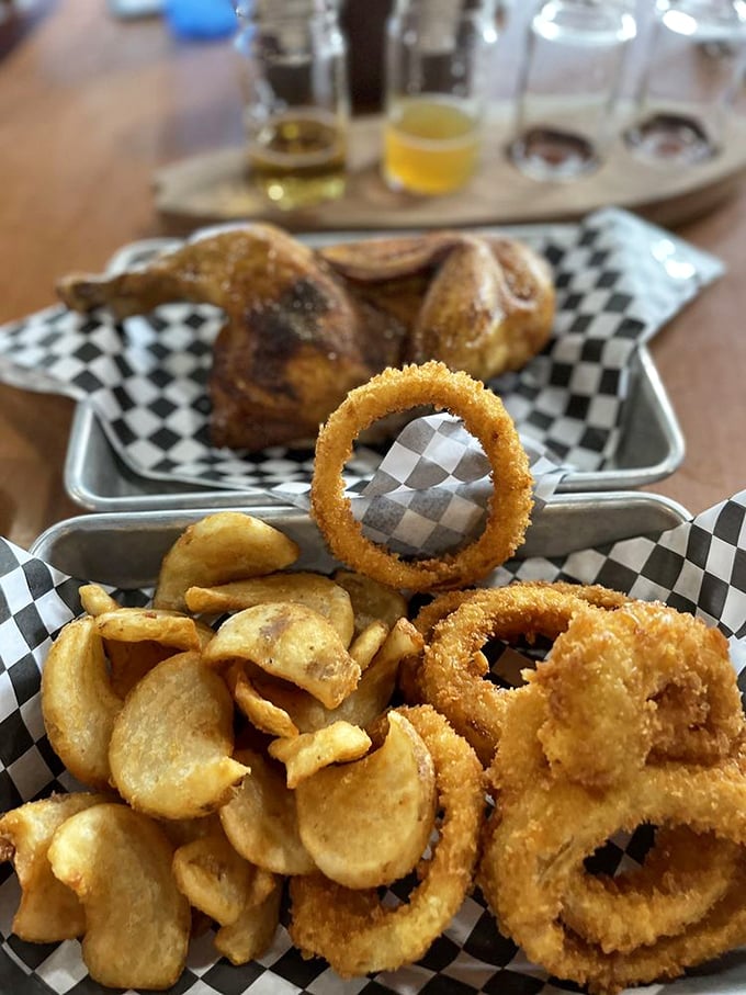 Crispy onion rings and house-made chips that deserve their own spotlight. These aren't mere sides – they're supporting actors stealing scenes.