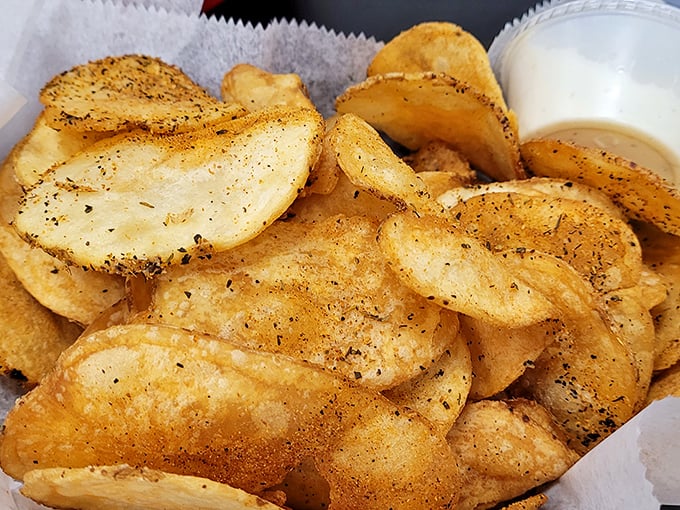 These aren't just chips—they're crispy discs of potato perfection. Seasoned with enough spice to make your taste buds do a happy dance.