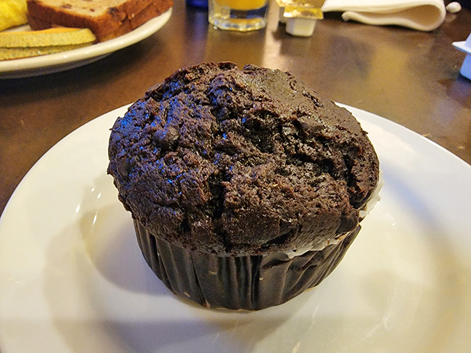 This chocolate muffin isn't just big – it's the size that makes other muffins feel inadequate. Dense, rich, and unapologetically decadent.