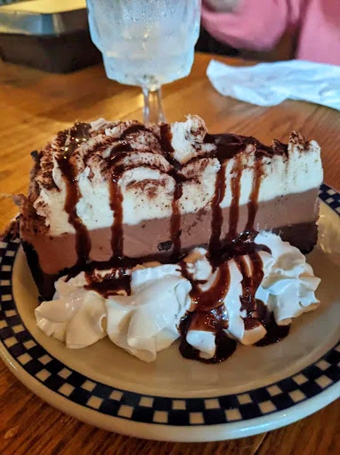 A chocolate dessert so decadent it should require signing a waiver. That whipped cream isn't decoration—it's necessary emotional support.