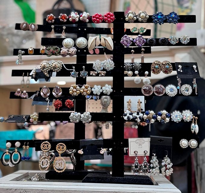 This earring display is like a constellation of vintage style—clusters of pearls, colorful stones, and intricate metalwork that would make your grandmother proud.