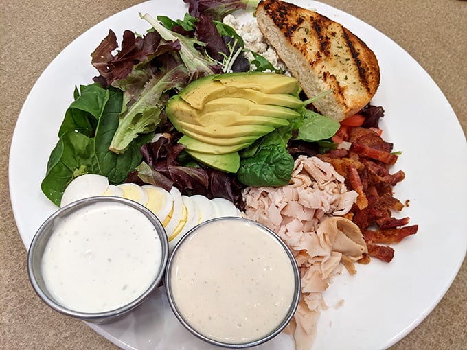 This Cobb salad isn't just lunch – it's a colorful landscape of flavors where avocado, bacon, and turkey coexist in perfect harmony.