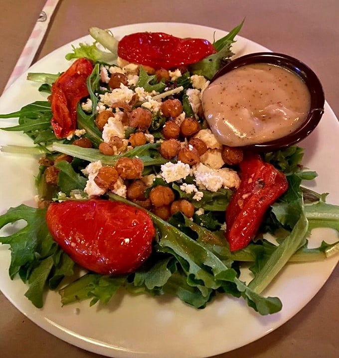 Even the salads demand respect here – wood-fired tomatoes, crispy chickpeas, and goat cheese prove that "eating light" doesn't mean sacrificing flavor.