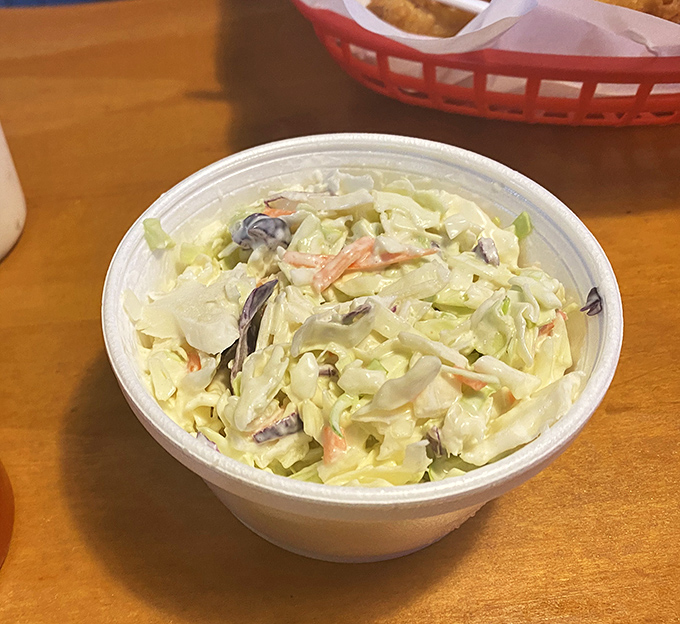 Creamy coleslaw that provides that perfect cool, crisp counterpoint to all the gloriously fried treasures on your plate – balance in all things!