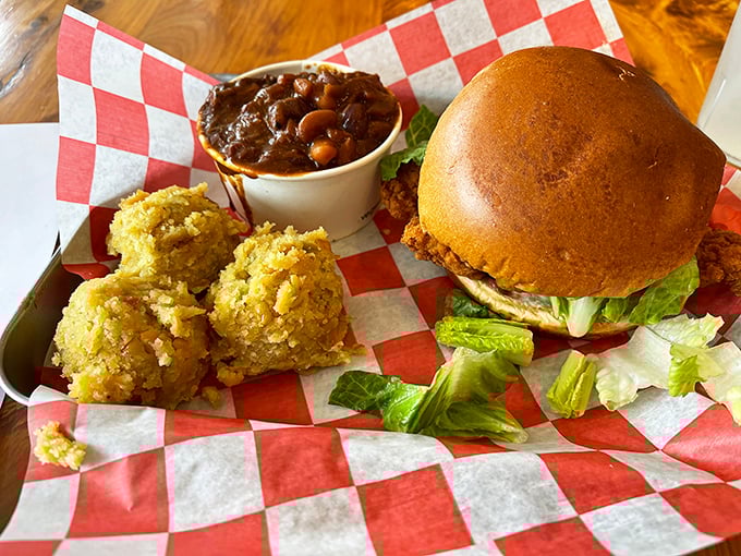 A barbecue trifecta: sandwich, cornbread, and beans. The kind of meal that requires both a fork and a nap afterward.
