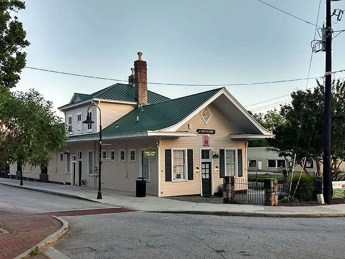 The Welcome Center looks like it should be selling tickets to the 1950s—complete with white picket fence and small-town hospitality.