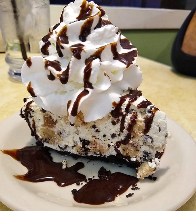 This cookies and cream pie with its mountain of whipped cream isn't just dessert – it's therapy you can eat with a fork.