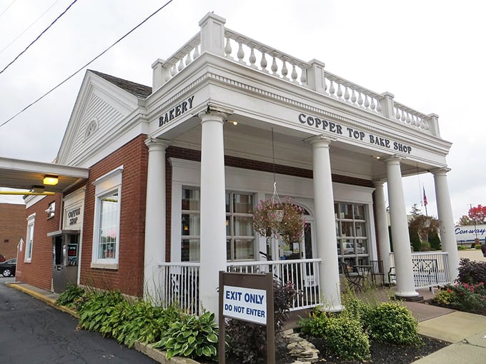 The Copper Top Bake Shop's stately columns aren't just architectural flourishes—they're sentinels guarding the gateway to carbohydrate heaven.
