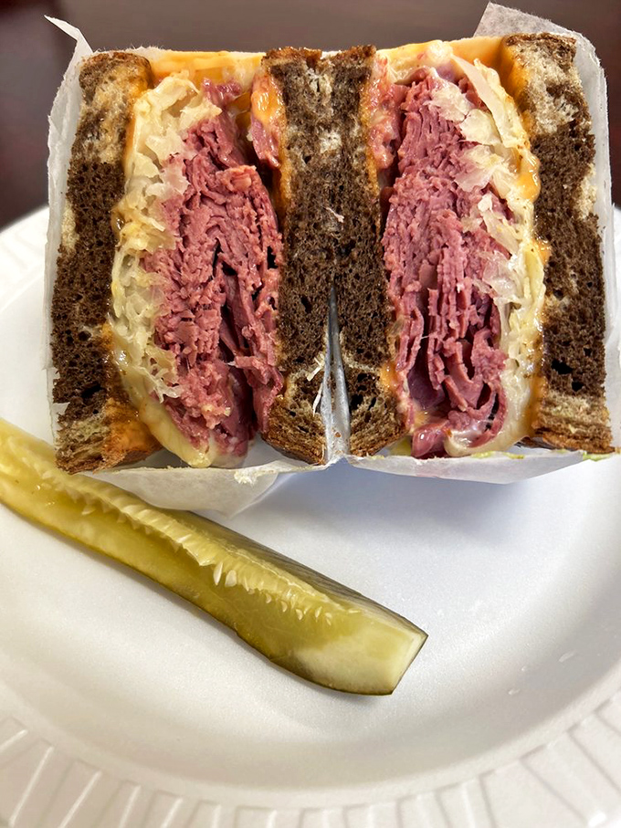 The corned beef Reuben isn't just a sandwich—it's architecture, with layers of pink meat, sauerkraut, and melted cheese creating a skyscraper of flavor.