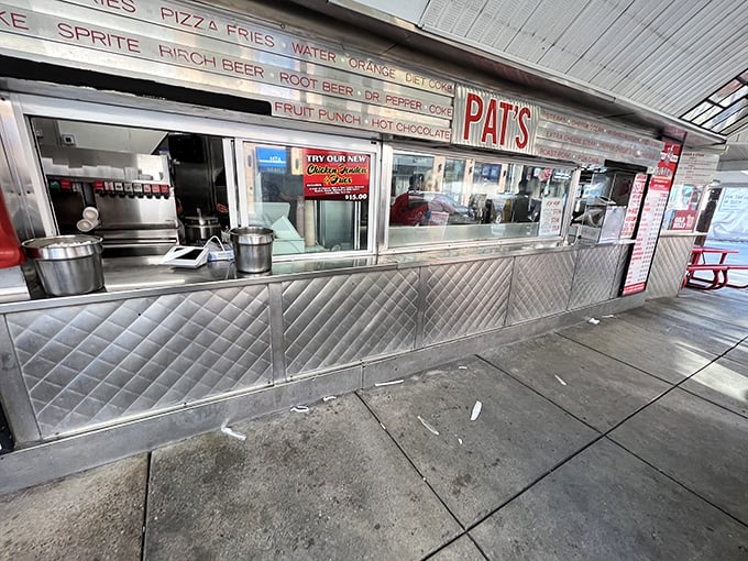 The ordering window—where dreams come true and tourists learn the hard way that "I'll have a cheesesteak" isn't specific enough.