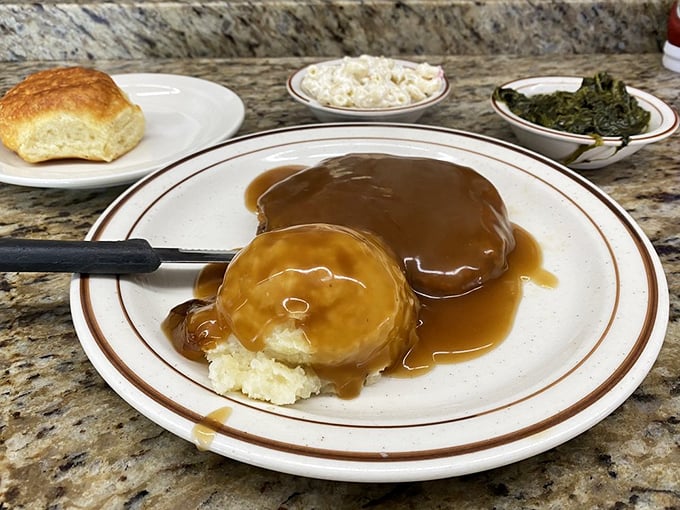 Country fried steak smothered in gravy isn't just a meal—it's a Southern tradition that demands respect, a knife, and possibly an afternoon nap.