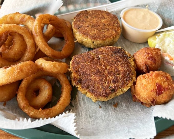 These crab cakes and onion rings aren't just food—they're edible postcards from a Florida that existed before mouse ears took over the state.