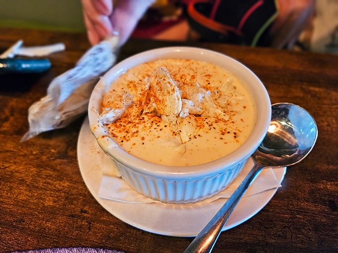 A bowl of crab soup that could warm the coldest sailor's heart. That sprinkle of spice on top isn't decoration—it's a promise of flavor.