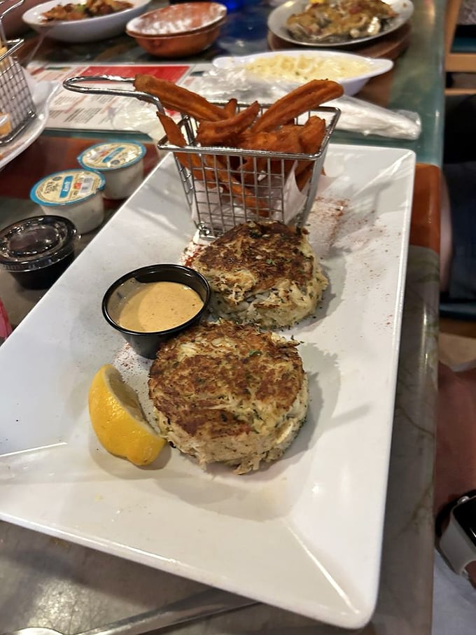 These crab cakes aren't just good—they're the kind that make Marylanders nervous. Served with a basket of fries that's basically happiness in fried form.
