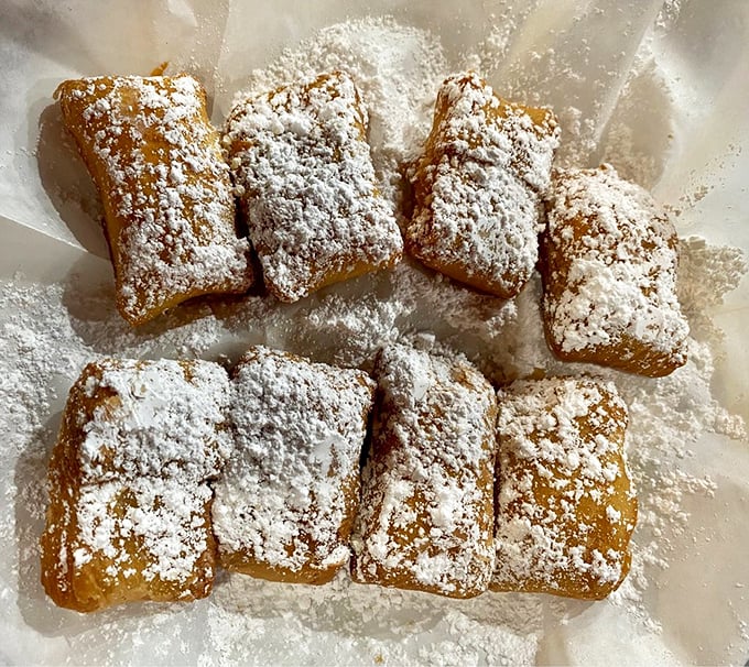 Powdered sugar-dusted beignets that would make New Orleans jealous – little pillows of fried dough that disappear faster than you can say "dessert."