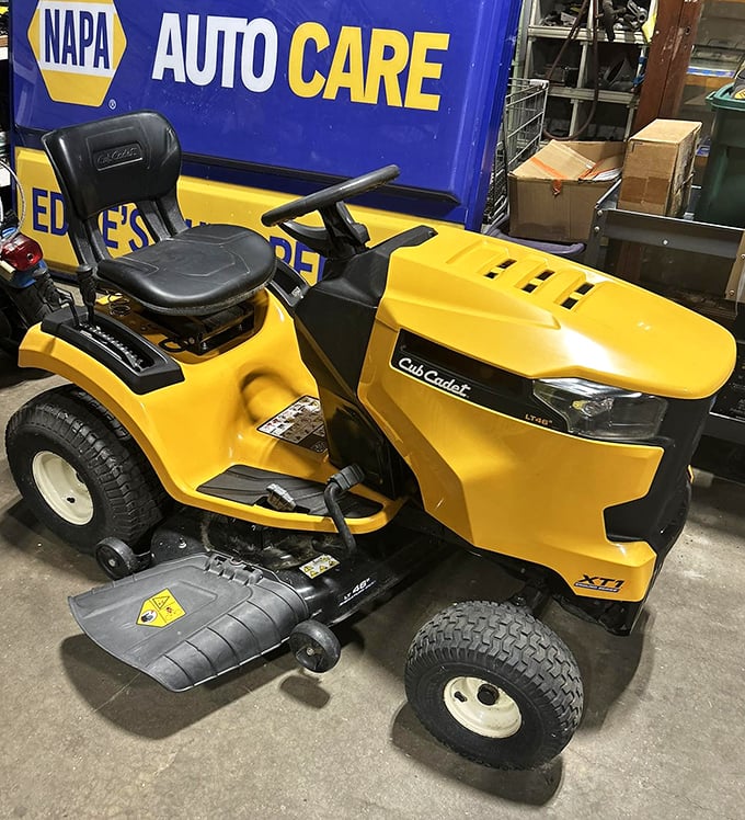 This sunshine-yellow Cub Cadet isn't just lawn equipment—it's the Cadillac of suburban Saturday mornings, with a side of fresh-cut grass.