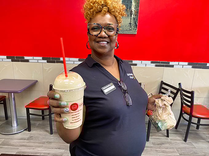 The smile says it all—when your job is making people happy through food, you're never really working. Hospitality served with genuine warmth.
