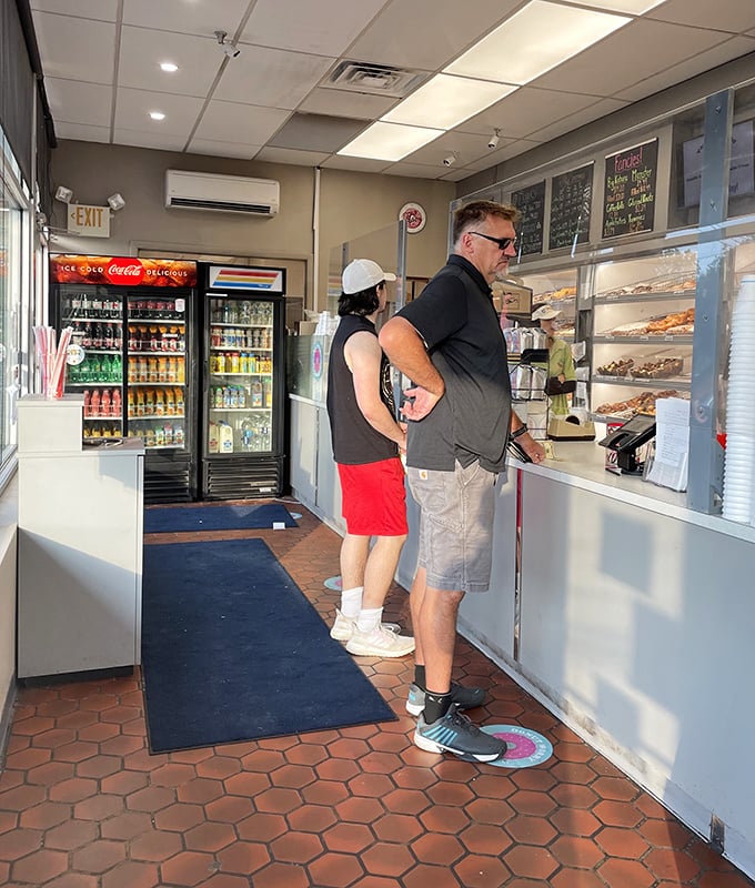 The line at Yum Yum isn't just customers waiting—it's a community of pilgrims on the same delicious quest. 