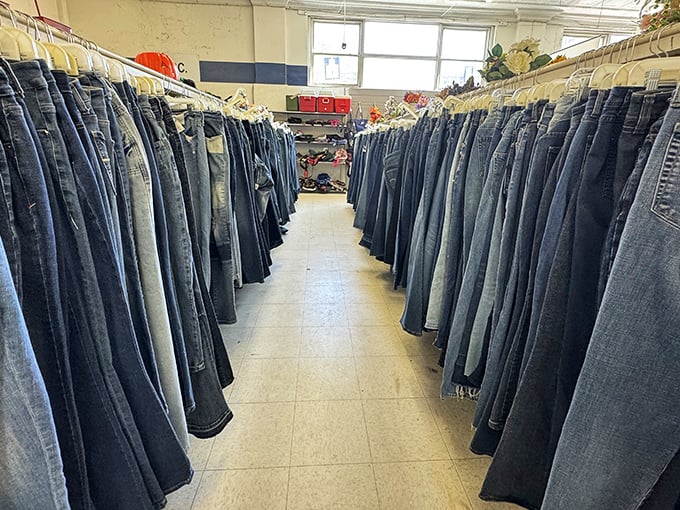 The denim corridor—a blue jean cathedral where pants of every wash and vintage stand at attention, ready for their second act.