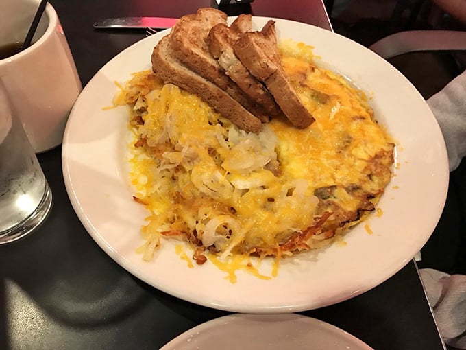 This Denver omelet is what happens when hash browns and cheese have a beautiful love child, with toast standing by as proud godparent.
