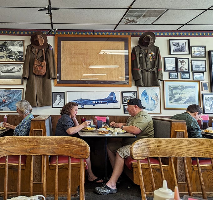 Military uniforms and aviation memorabilia create the perfect backdrop for conversations over coffee and country-sized portions.