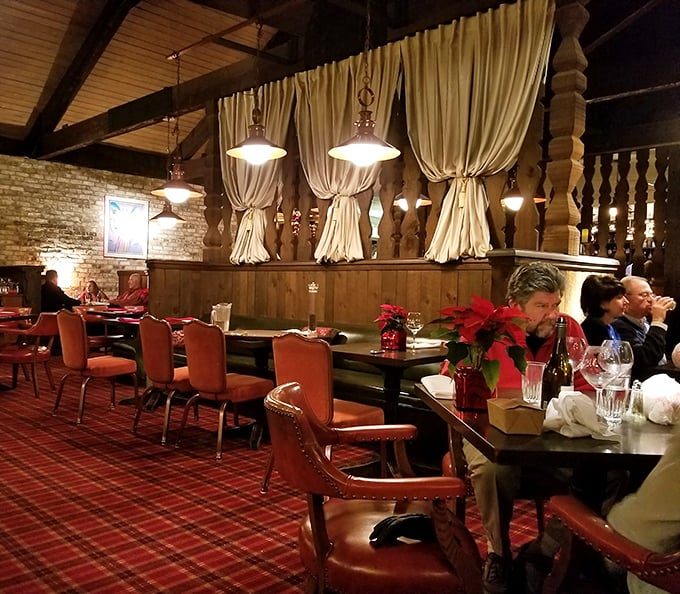 Red plaid carpet, cream curtains, and poinsettias create the cozy dining atmosphere that makes winter in Pennsylvania something to celebrate, not endure.
