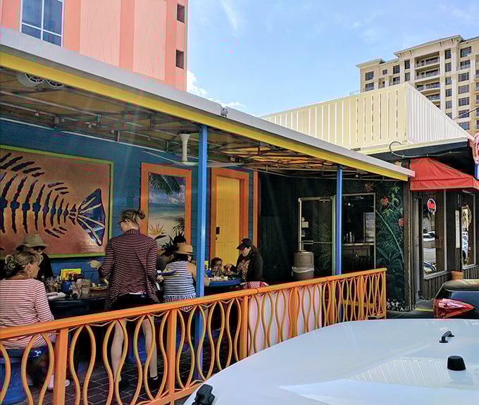 Happy diners proving that good food creates the best kind of community gathering spot.