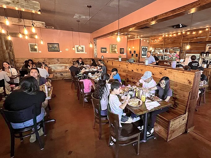A dining room humming with the universal language of good food—forks pausing mid-air, nodding heads, and that particular silence that falls when everyone's too busy enjoying to talk.
