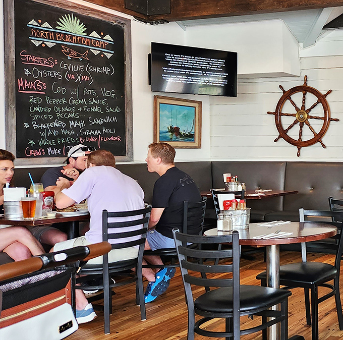 Where nautical meets comfortable—a chalkboard menu, ship's wheel, and diners who know they've discovered Neptune Beach's worst-kept secret. 