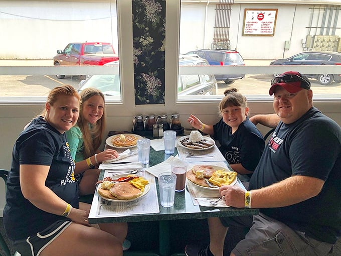 Happy families creating breakfast memories—the universal language of "please pass the syrup" transcends all differences.