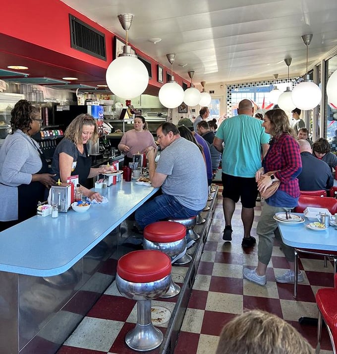 The breakfast rush – where strangers become temporary neighbors united by the universal language of "pass the syrup, please."