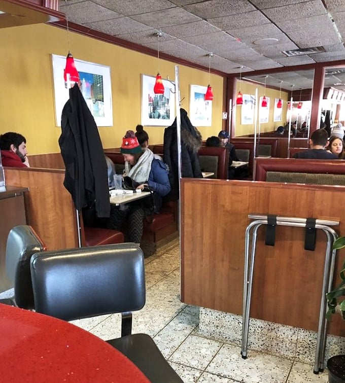 The dining area buzzes with the energy of conversations and clinking silverware, where strangers become temporary neighbors united by hunger.