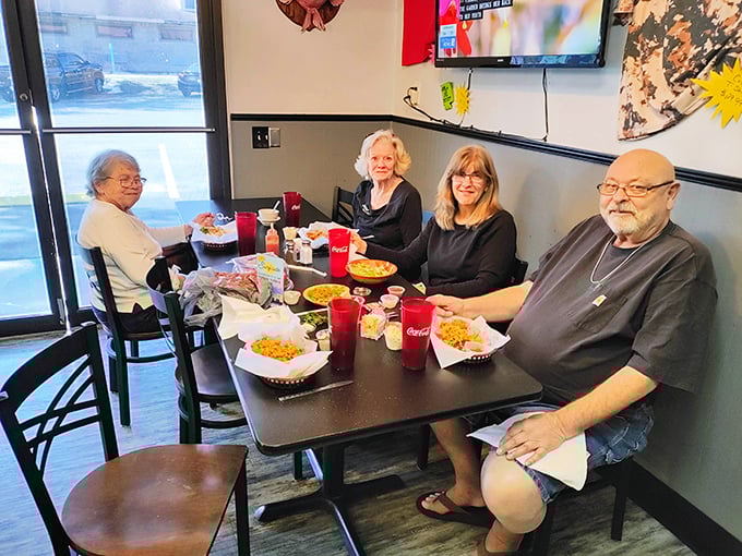 The true measure of a great local spot: tables filled with happy diners sharing stories over plates of seafood that keep them coming back.