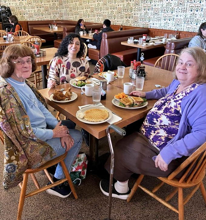 Three generations sharing pancakes and stories – the true measure of a great diner isn't just the food, but the memories made around it.