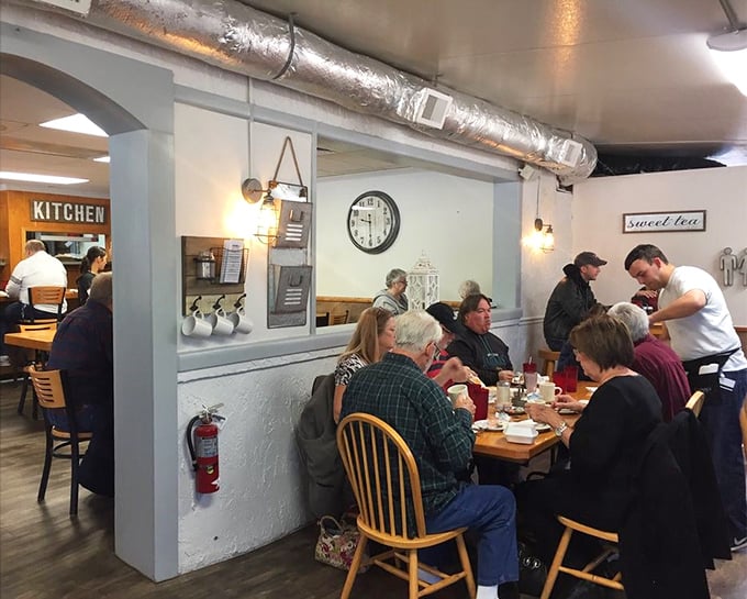 The breakfast club in session—locals gathering for their daily ritual of coffee and conversation. Community served alongside pancakes.