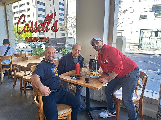 Three happy diners enjoying the simple pleasure of good food and conversation—the universal language spoken fluently at Cassell's.