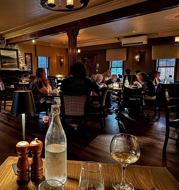 The dining room hums with the universal language of good food and great company, wood beams overhead witnessing countless celebrations.