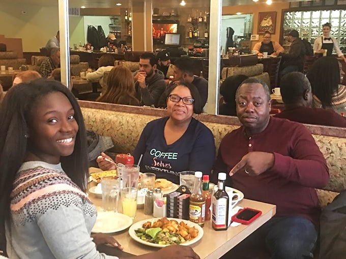 Happy diners sharing a moment of breakfast bliss—the universal expression of "I made the right life choice coming here today" written across their faces.