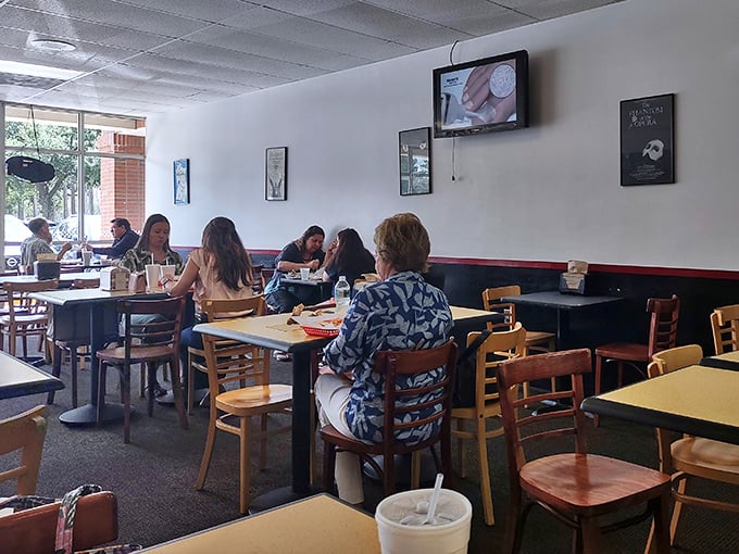 The lunch crowd knows the secret—conversations flow easier when punctuated by bites of exceptional sandwiches in unpretentious surroundings.