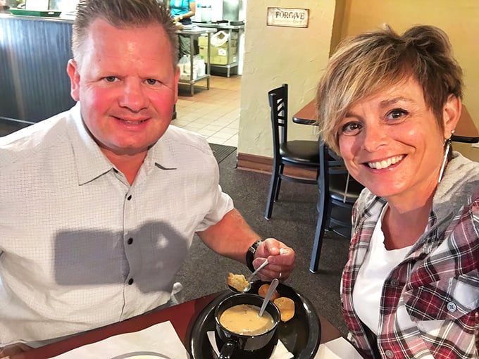 Happy diners sharing a moment over what appears to be soup—because good food creates memories that outlast the meal itself.