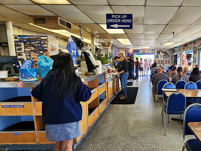The ordering counter where seafood dreams begin. Join the line – good things come to those who wait.
